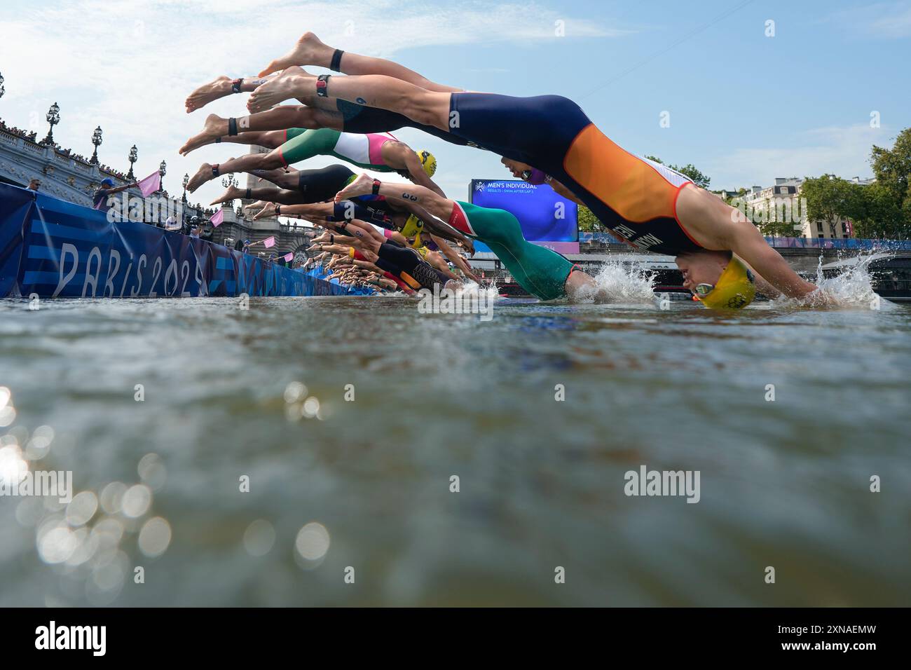Athletes dive into the water for the start of the men's individual ...