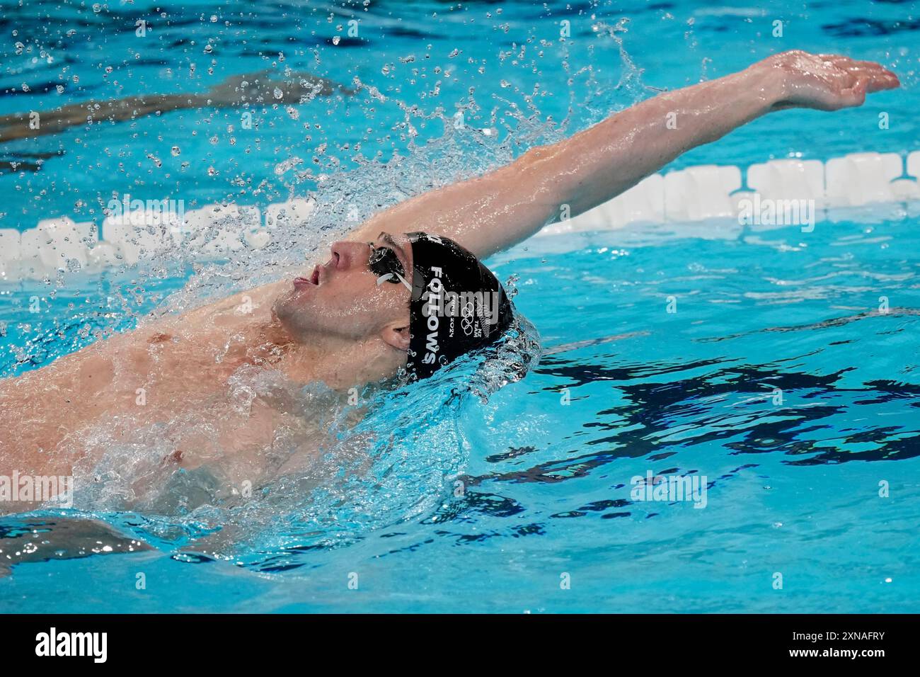 Kane Follows, of New Zealand, competes during a heat in the men's 200 ...