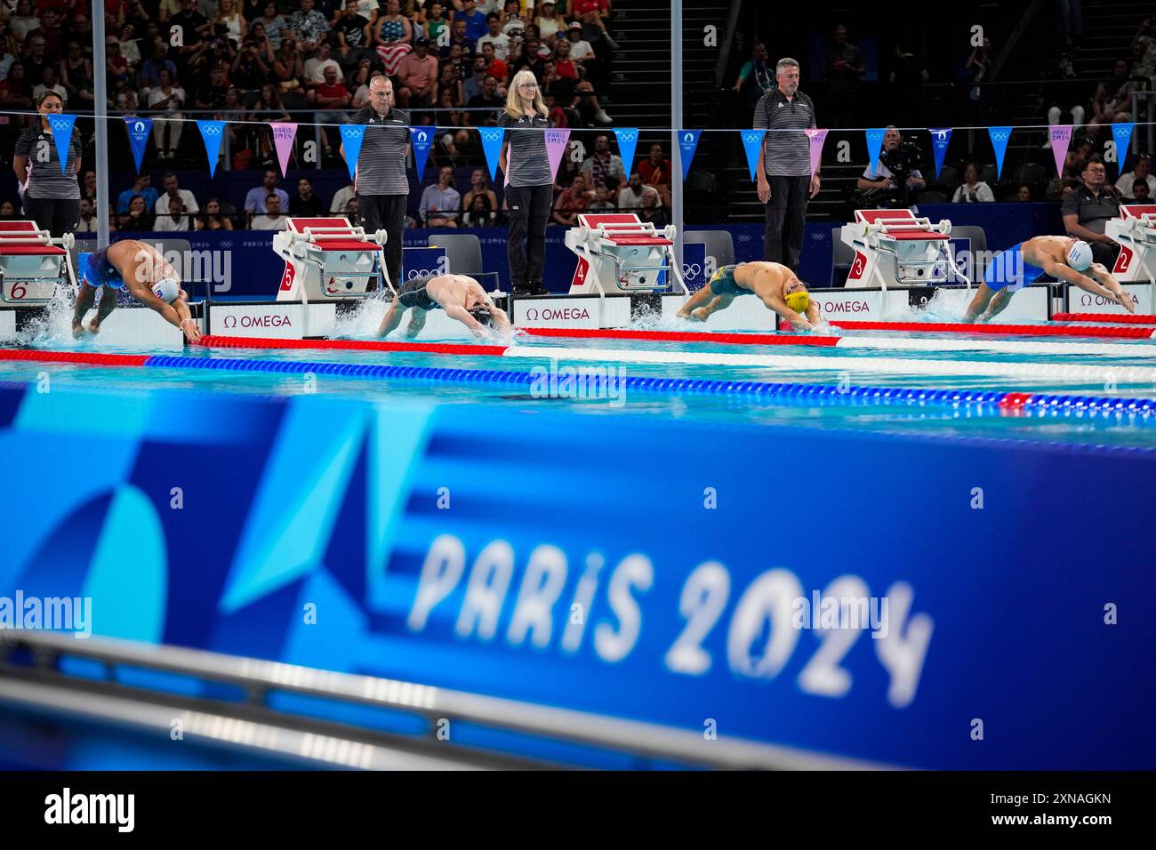 Swimmers start their heat of the men's 200-meter backstroke at the 2024 ...