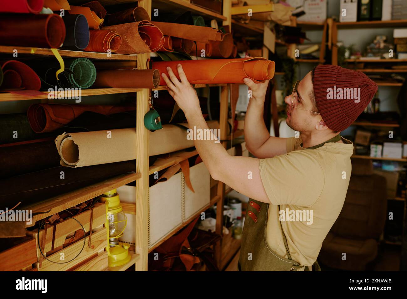 Tailor taking roll fabric hi-res stock photography and images - Alamy