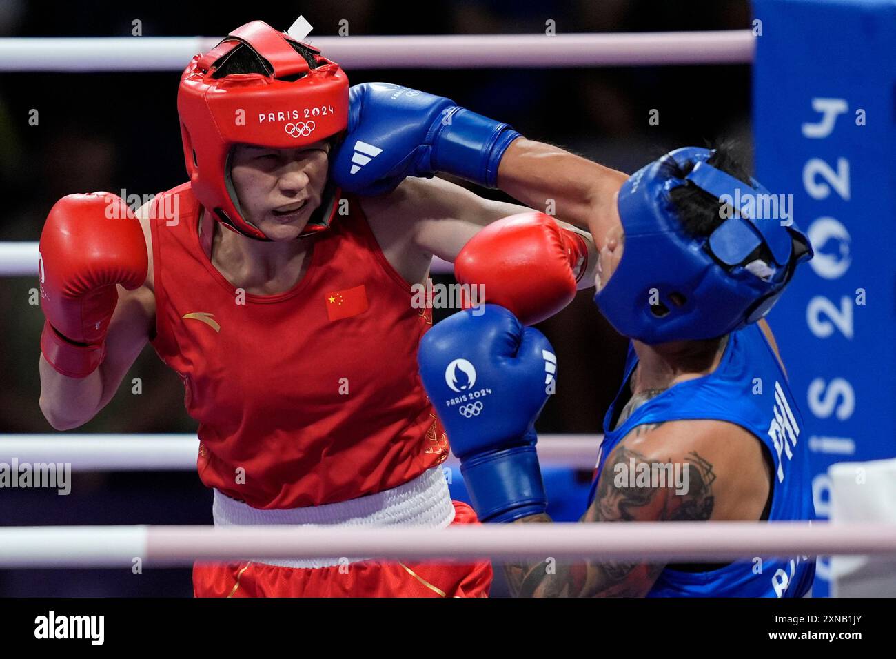 Philippines' Hergie Bacyadan hits China's Li Qian in their women's 75 ...