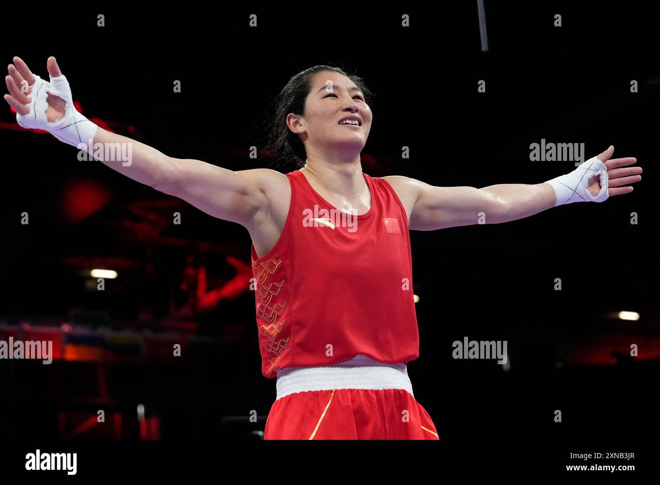 China's Li Qian celebrates after defeating Philippines' Hergie Bacyadan ...