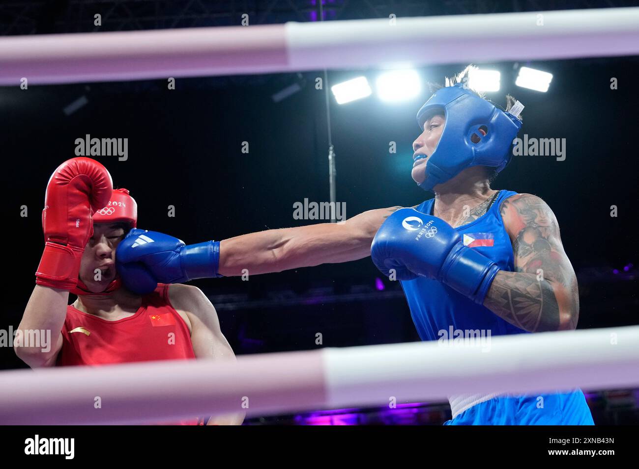 Philippines' Hergie Bacyadan hits China's Li Qian in their women's 75 ...