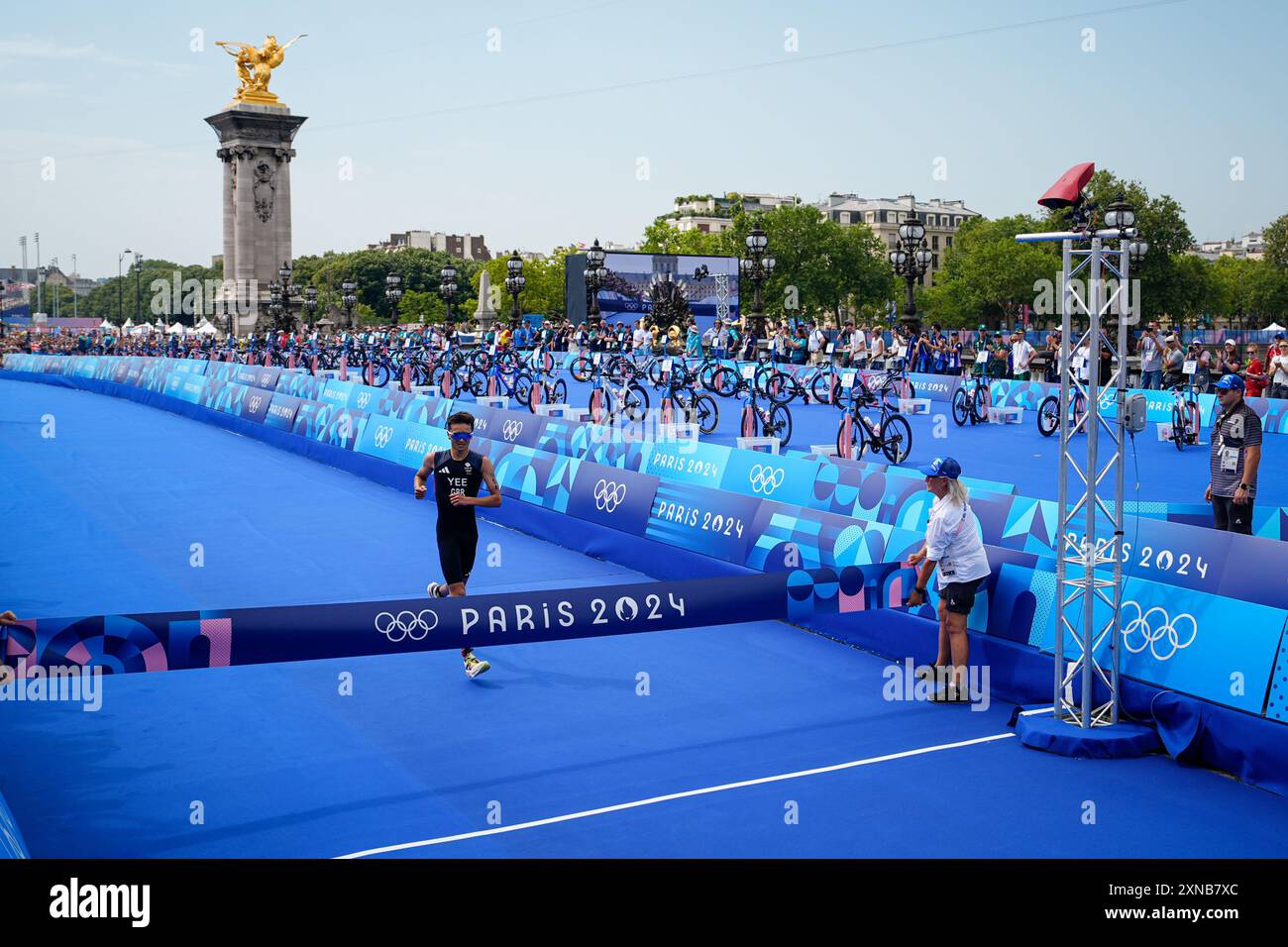 Britain's Alex Yee crosses the finish line to win the gold medal at the ...