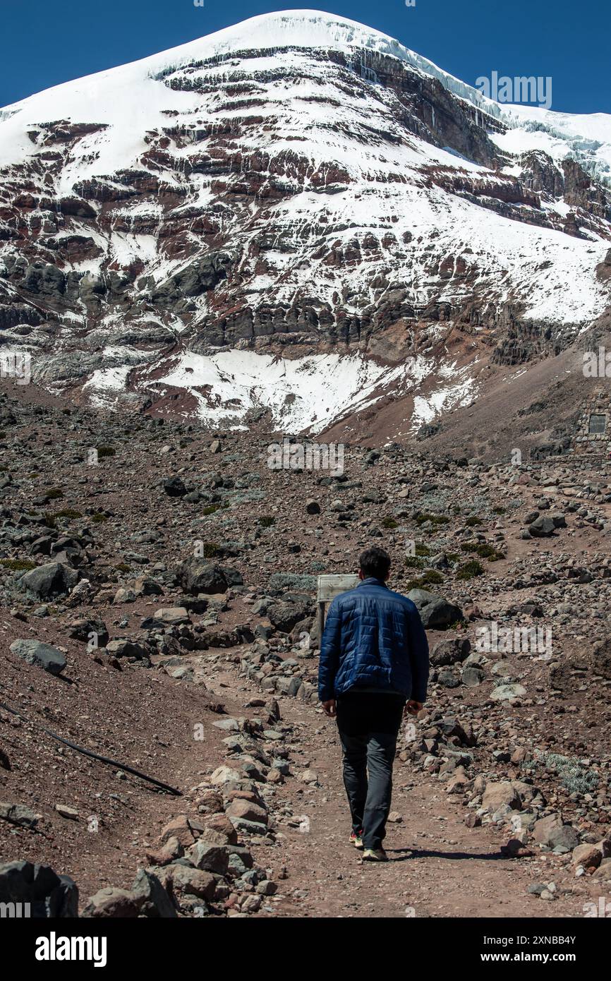 vertical mountaineer viewed from behind, trekking towards the summit of ...