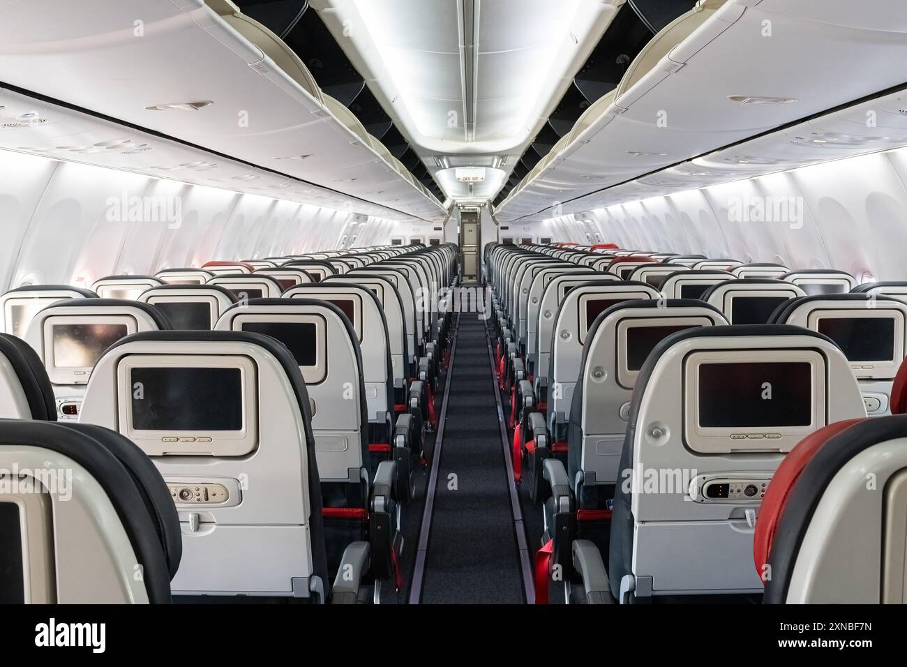 Perspective view of empty aircraft seats and lights Stock Photo - Alamy