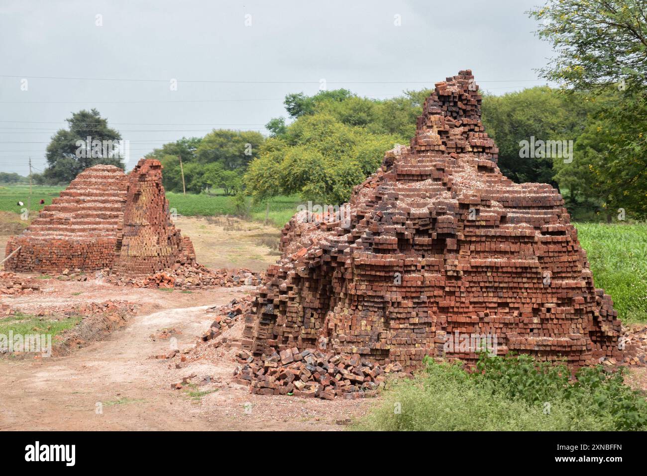 Stacked red bricks, ready for construction, brick kiln site Stock Photo ...