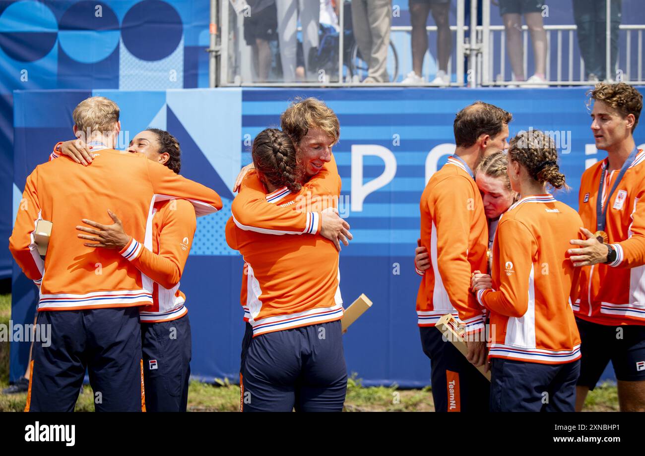 PARIS - The men and women of the double sculls embrace each other after ...