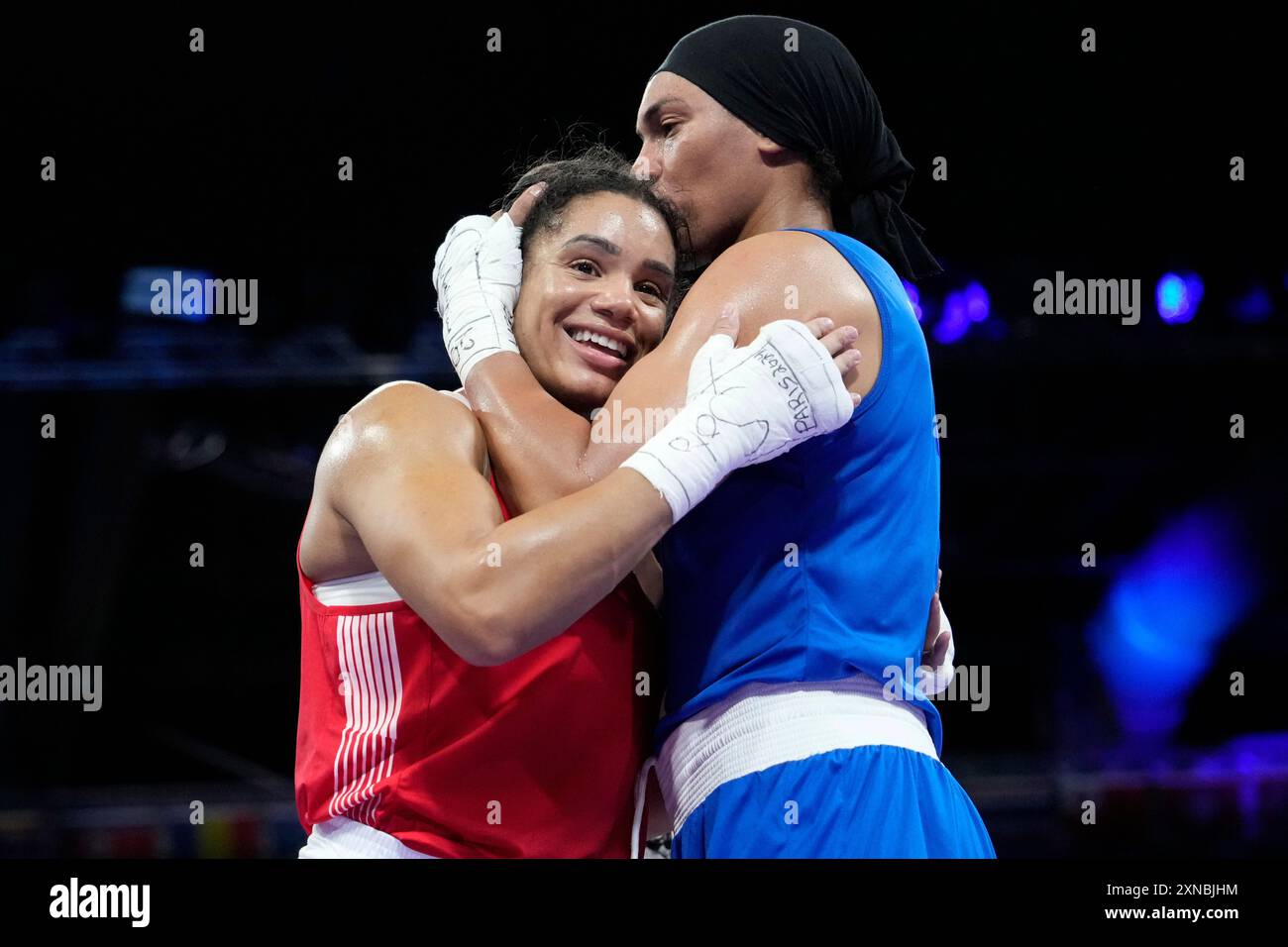Morocco's Khadija Mardi, right, embraces Britain's Chantelle Reid after ...