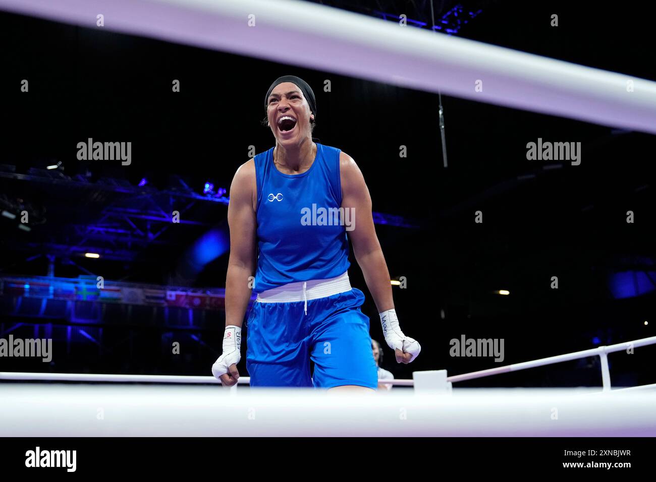 Morocco's Khadija Mardi celebrates after defeating Britain's Chantelle ...