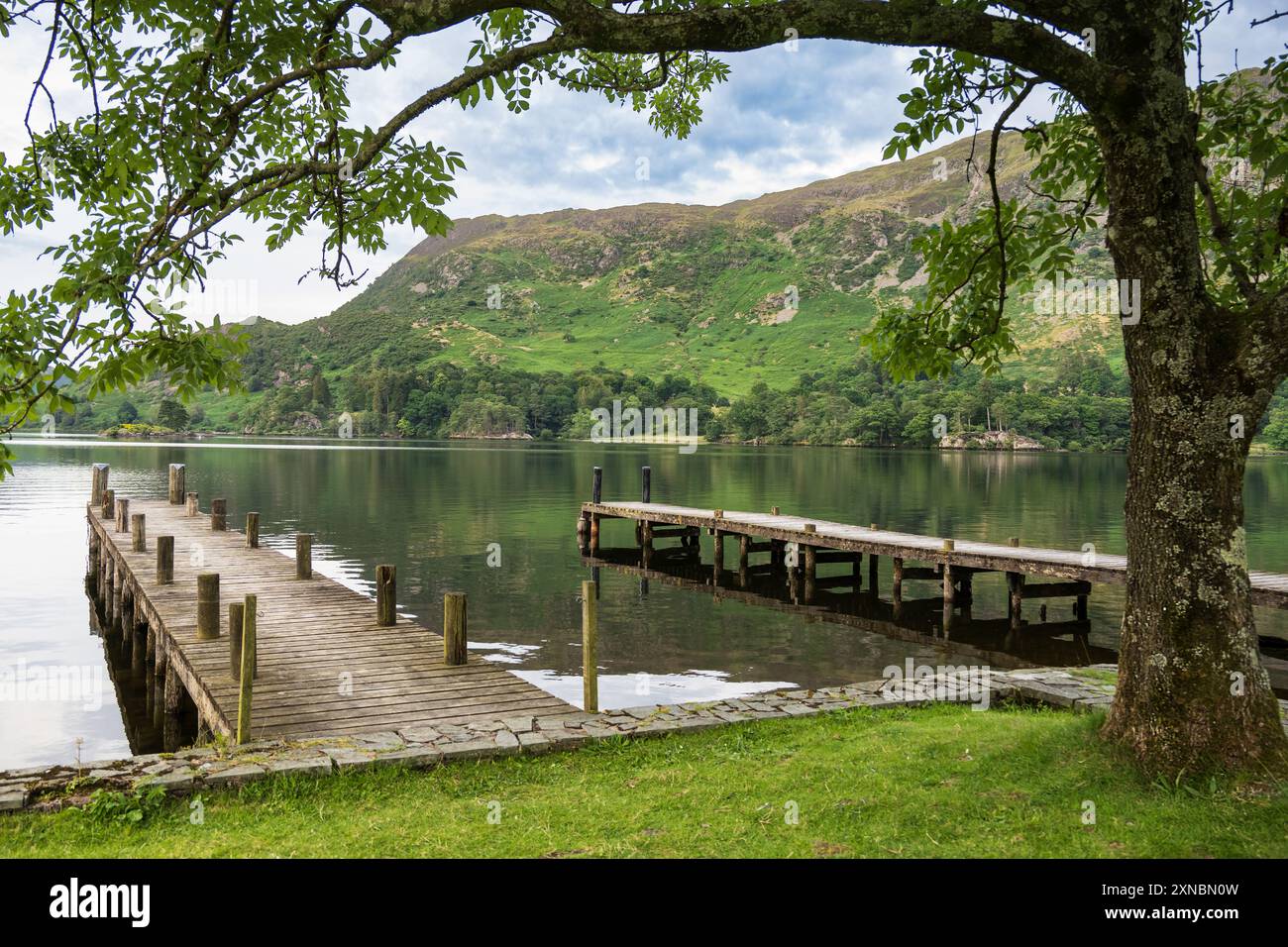Twin jettys on Ullswater in evening light Stock Photo - Alamy