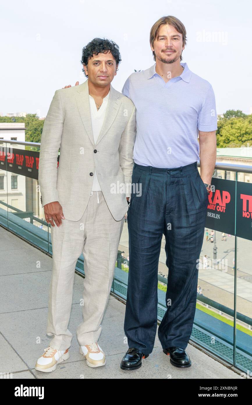 Berlin, Germany. 31st July, 2024. Director M. Night Shyamalan (l) and ...