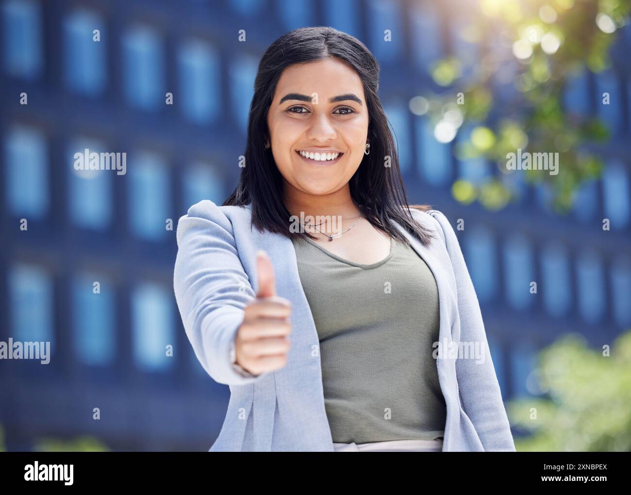 Business, woman and portrait in city with thumbs up for commercial ...