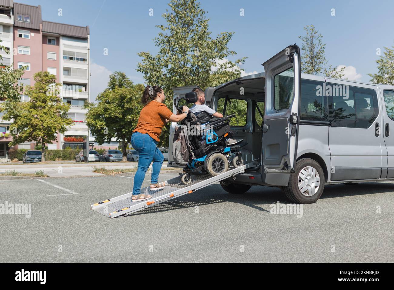 Push wheelchair up ramp hi-res stock photography and images - Alamy
