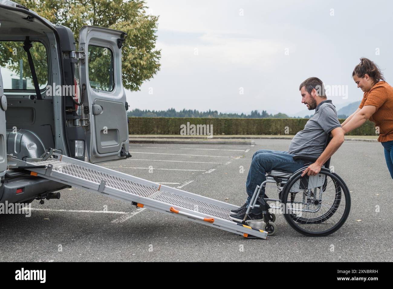 Push wheelchair up ramp hi-res stock photography and images - Alamy