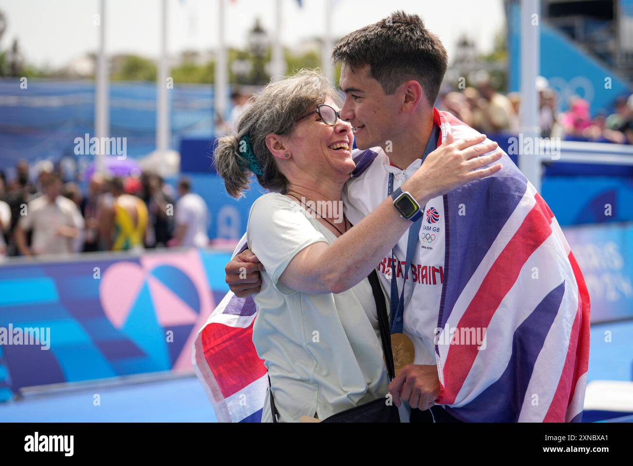 Gold medalist Britain's Alex Yee hugs his mother Emma Amos Yee at the ...
