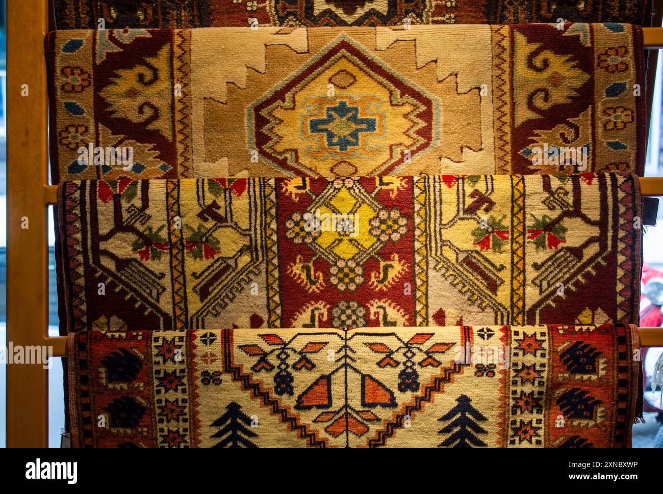 Traditional Turkish rug textile with patterns in bazaar Stock Photo - Alamy