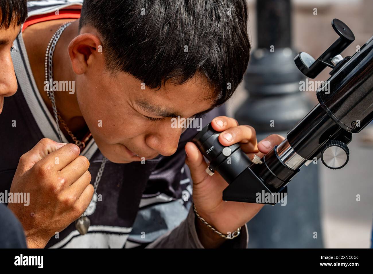 Community looking at telescope for the eclipse in Mapimi, Mexico Stock ...