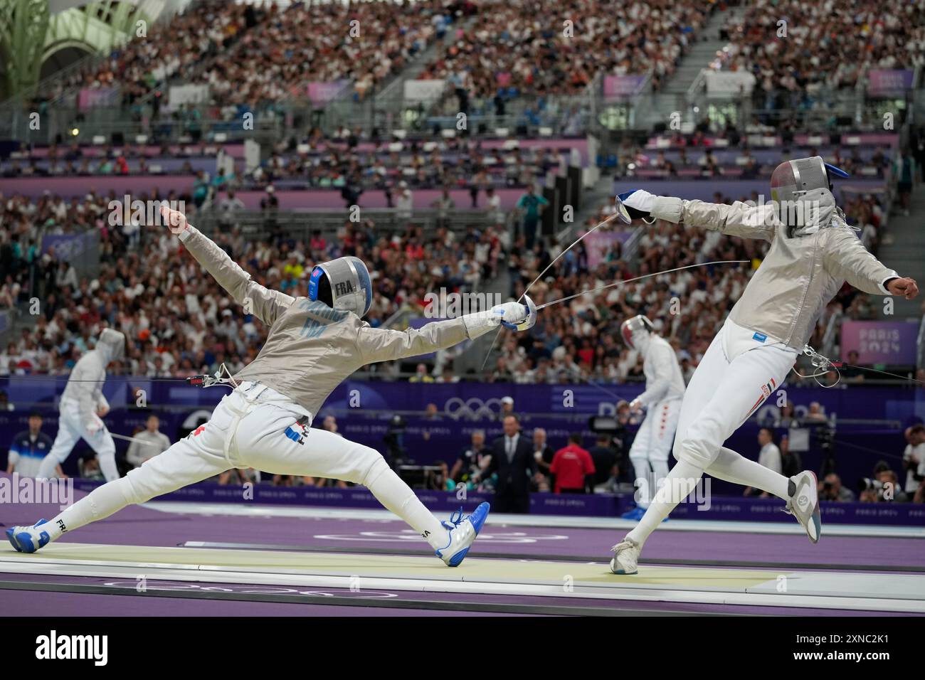 France's Maxime Pianfetti, left, competes with Egypt's Ziad Elsissy in ...