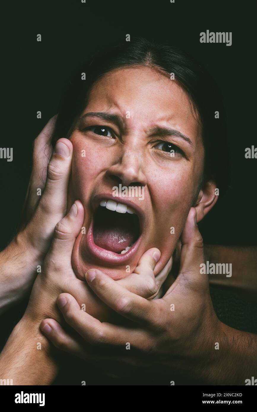 Violence, portrait and woman with hands on face in fear, terror and ...