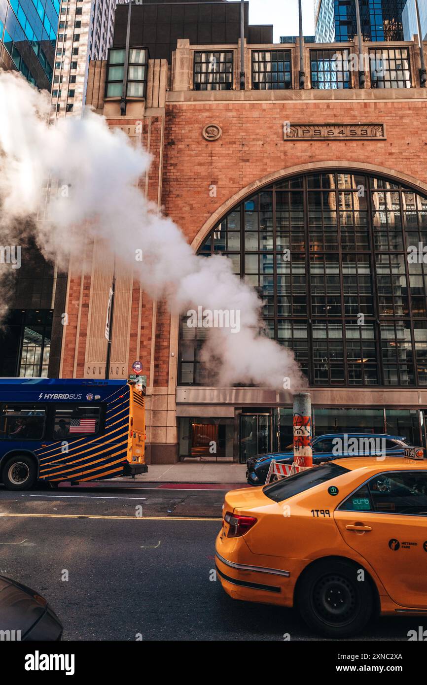 Car, bus and the famous yellow taxi on the road in downtown New York ...
