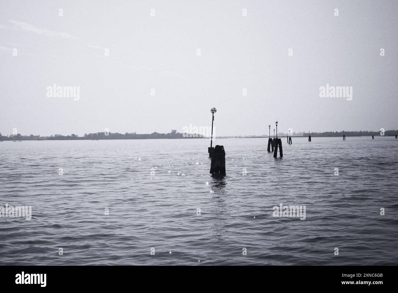 Briccola, the venetian channel markers snaking across the lagoon seen ...