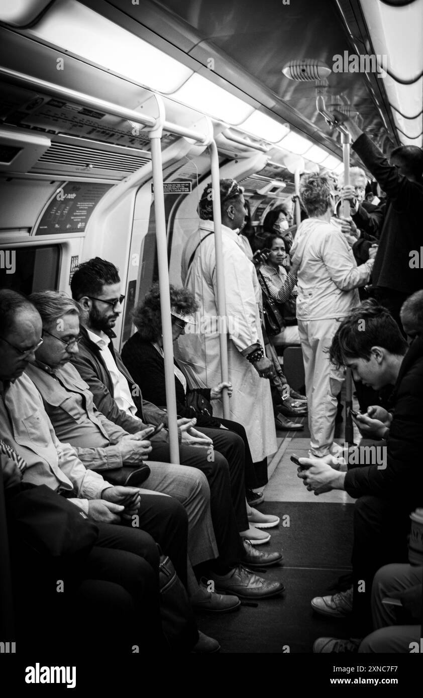 Crowded train boarding station Black and White Stock Photos & Images ...