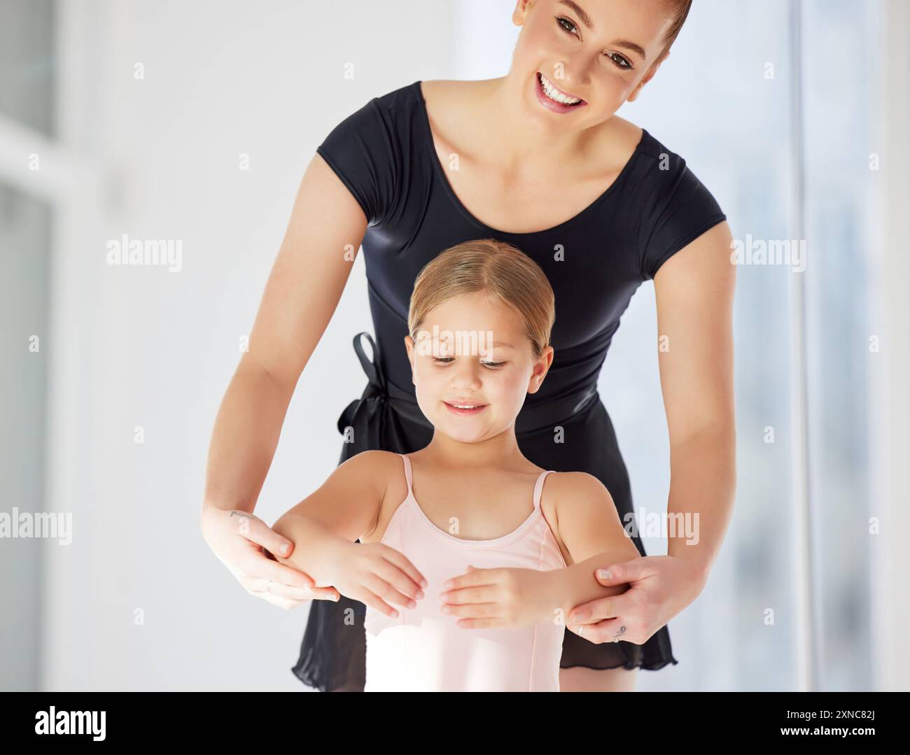 Woman, girl and ballet with help at class, lesson or club for learning ...