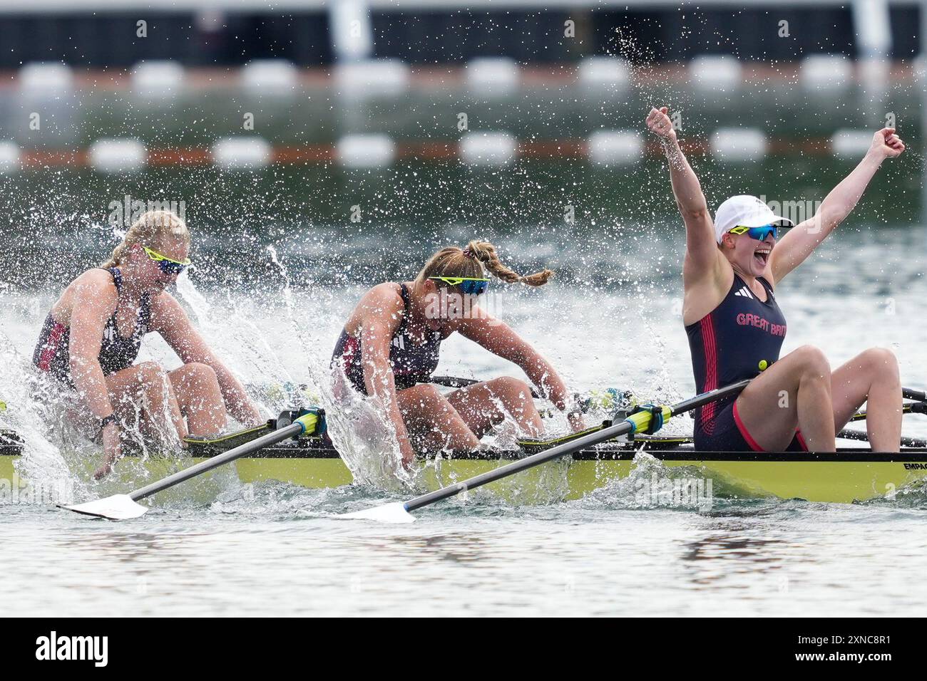 Members of team Britain react to winning gold in the women's quadruple ...