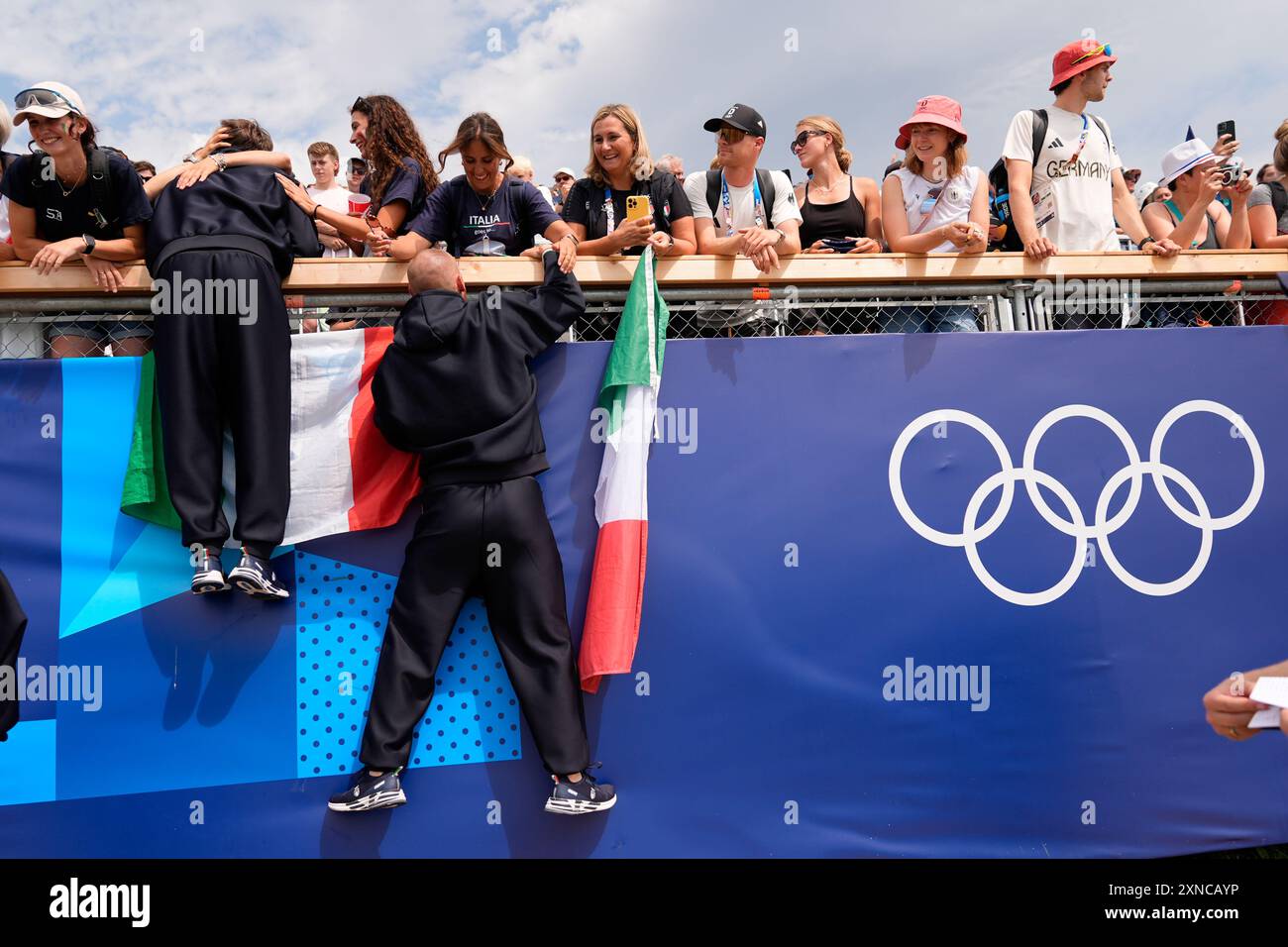 Italy's Luca Rambaldi, right, and a teammate celebrate the silver medal ...
