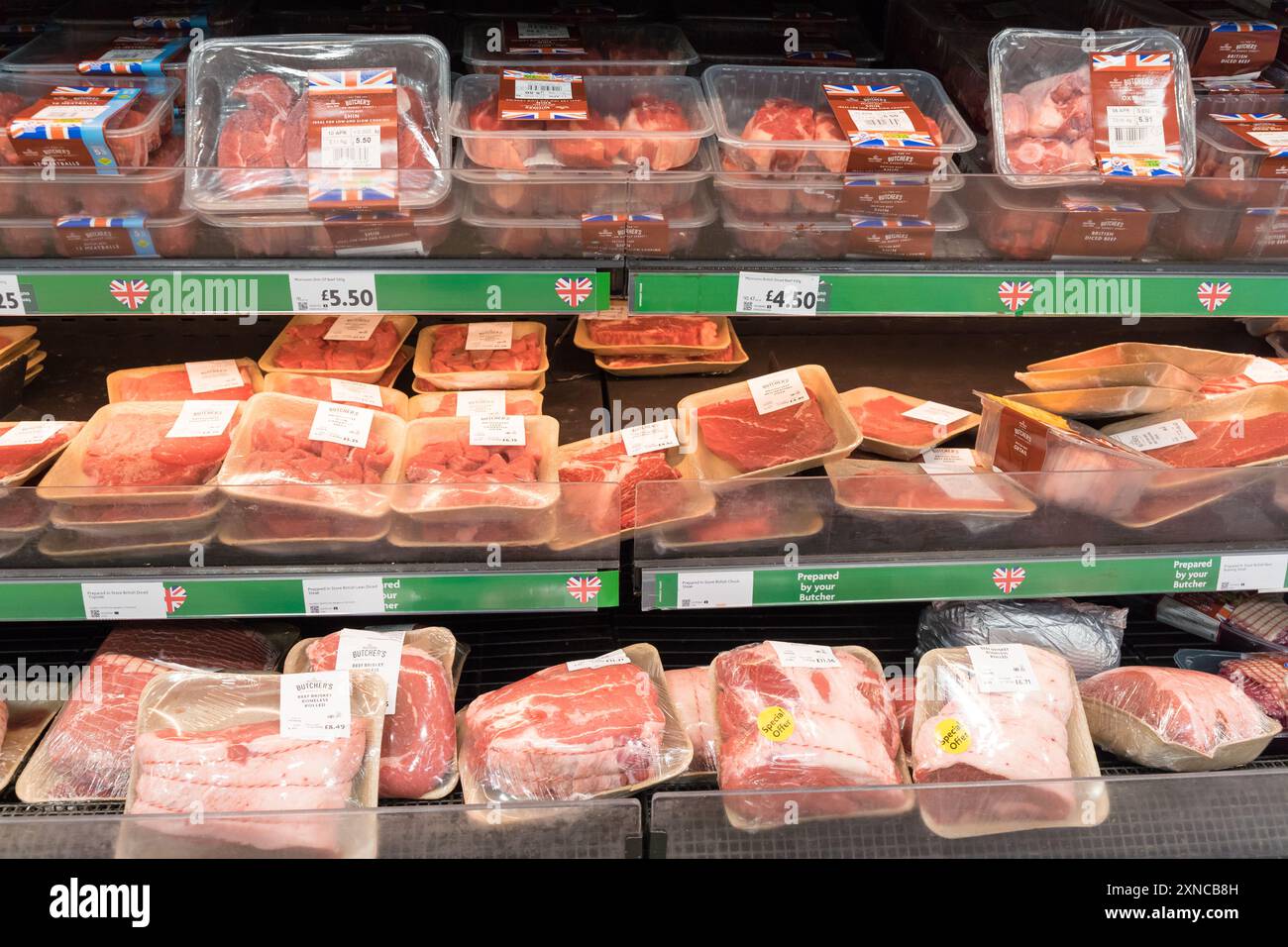 pre-packed raw meats , pork chops, steaks, joints on display for sale ...