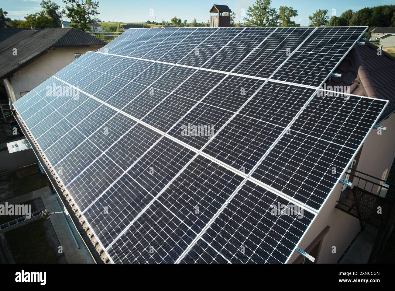 Aerial top view of new modern house cottage with solar photovoltaic ...