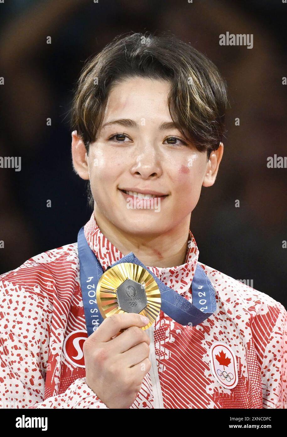 Canada's Christa Deguchi poses with her gold medal after winning the ...