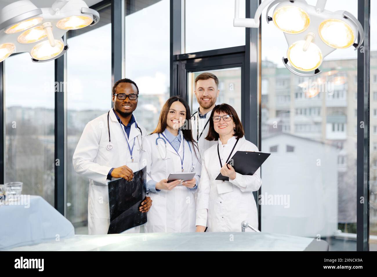 Group of doctors standing together in hospital setting Stock Photo - Alamy