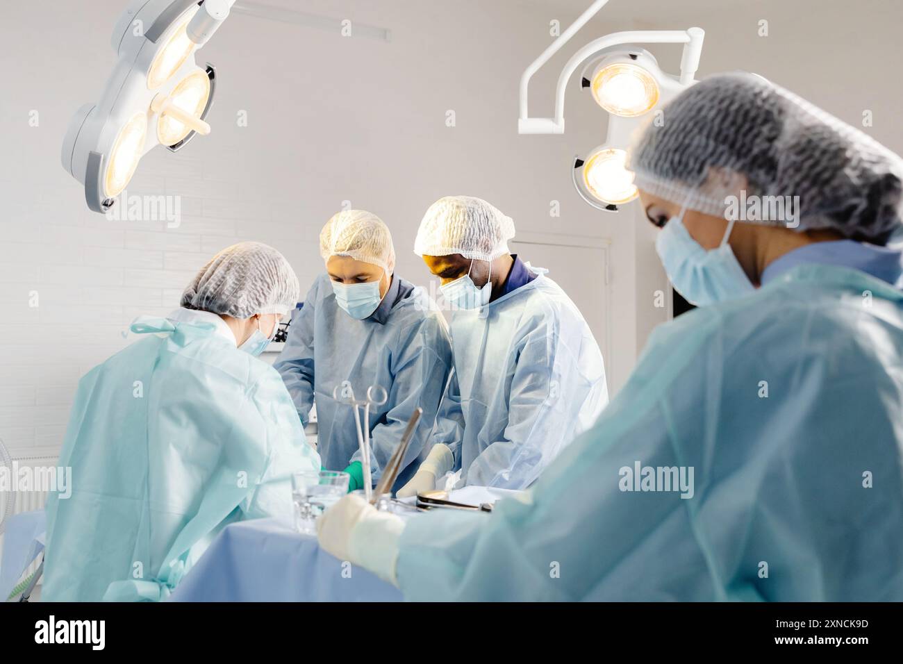 Group of doctors performing surgery in operating room Stock Photo - Alamy