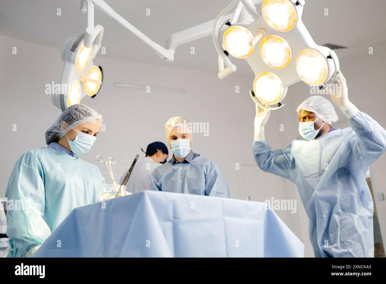 Focused surgeon performing surgical operation hi-res stock photography ...