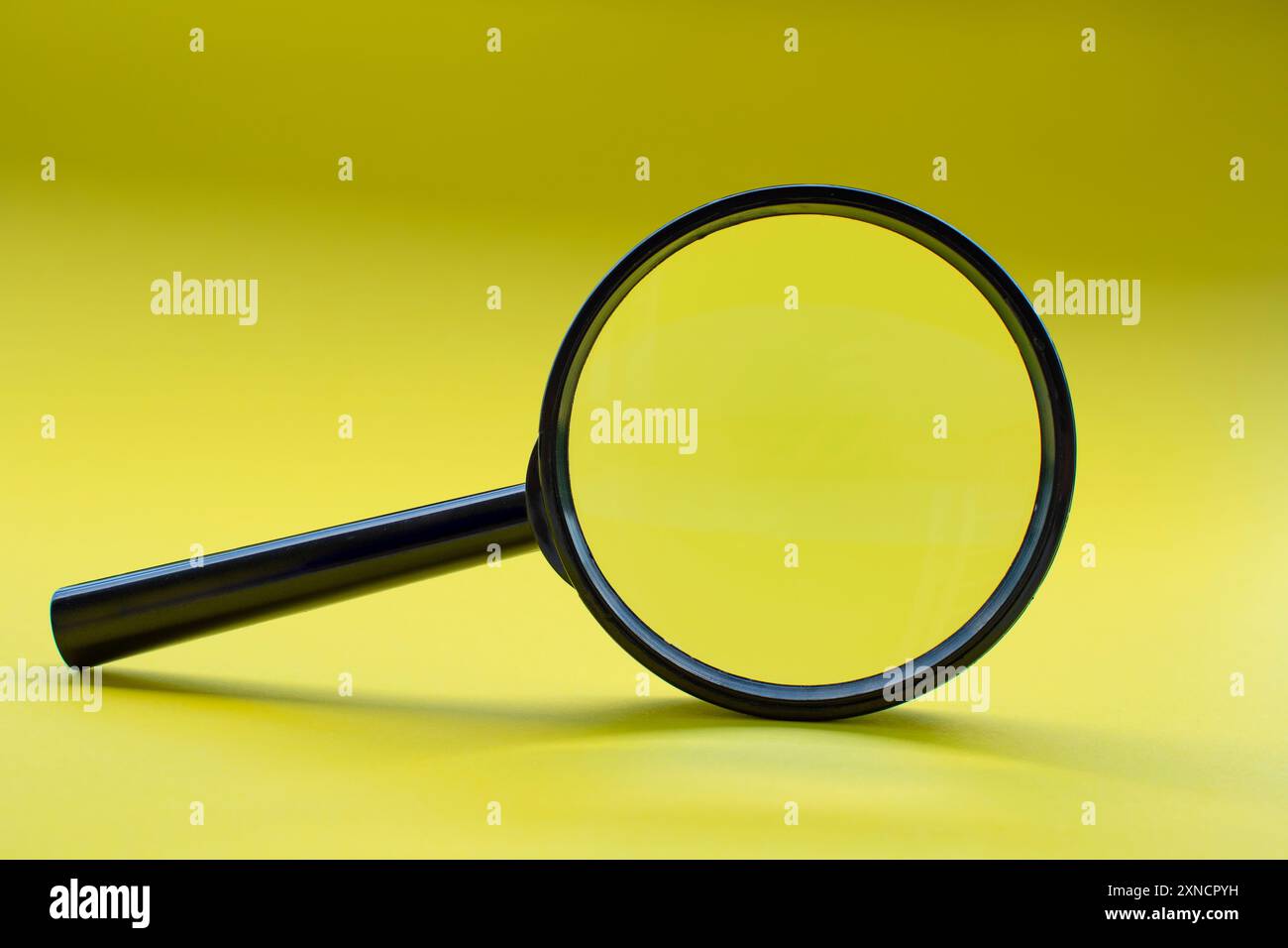 Magnifying glass on yellow background with customizable space for text ...