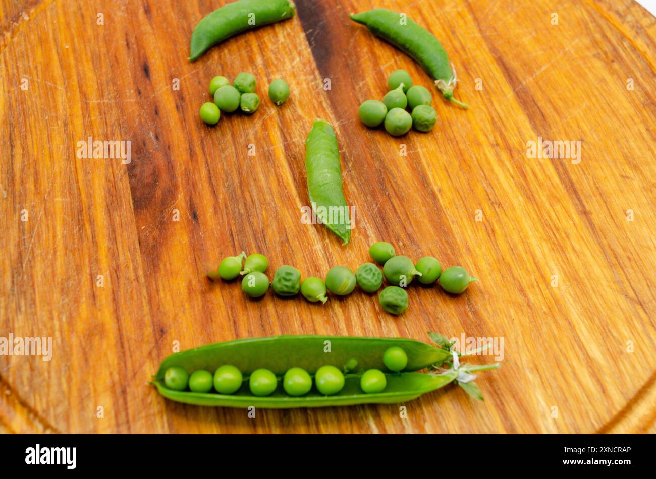 Peas in pod face hi-res stock photography and images - Alamy