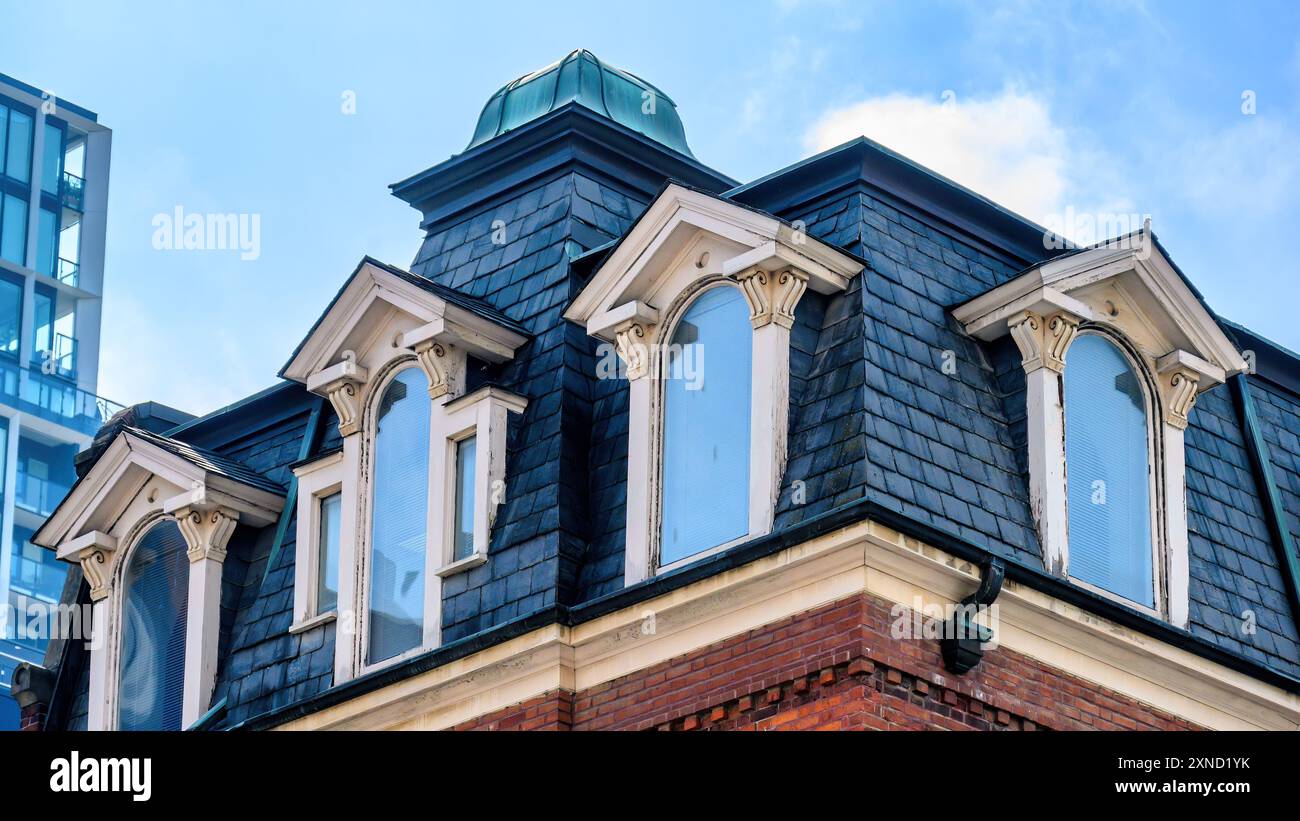 Toronto, Canada - July 30, 2024: Close-up of windows in the rooftop of ...