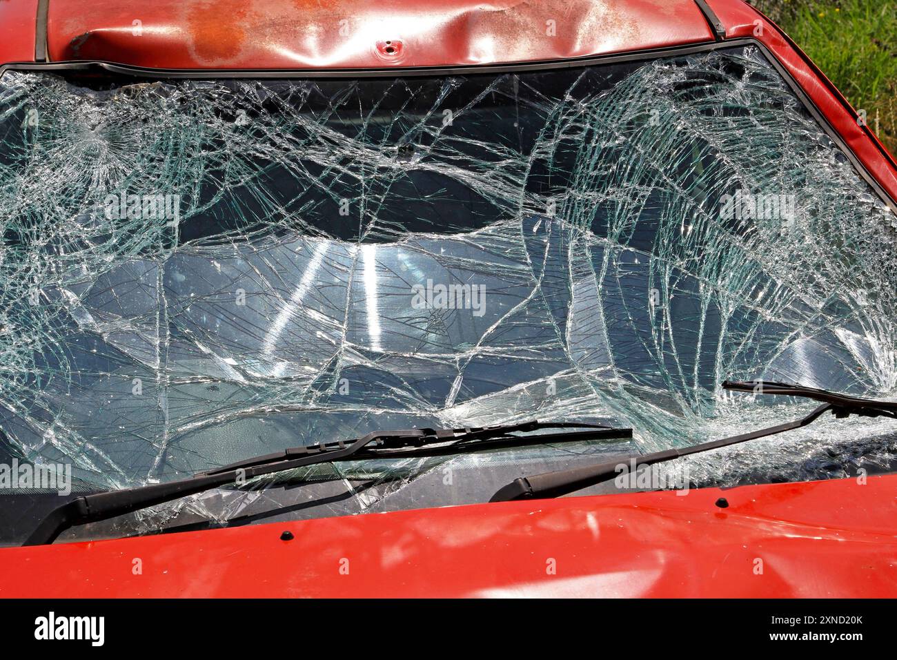 Broken Windscreen at Red Car in Traffic Accident Damage Stock Photo - Alamy