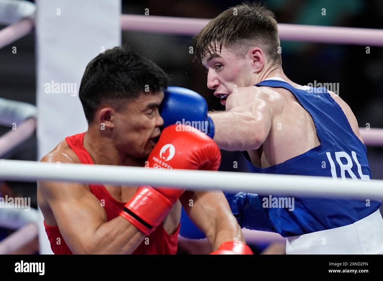 Ireland's Jude Gallagher hits Philippines' Carlo Paalam in their men's ...