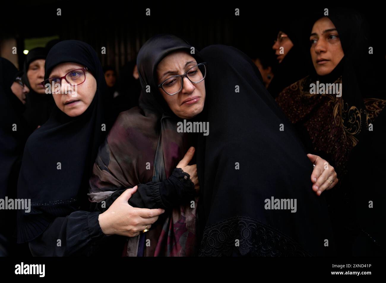The mother of Amira and Hassan Fadlallah, centre, the two children who ...