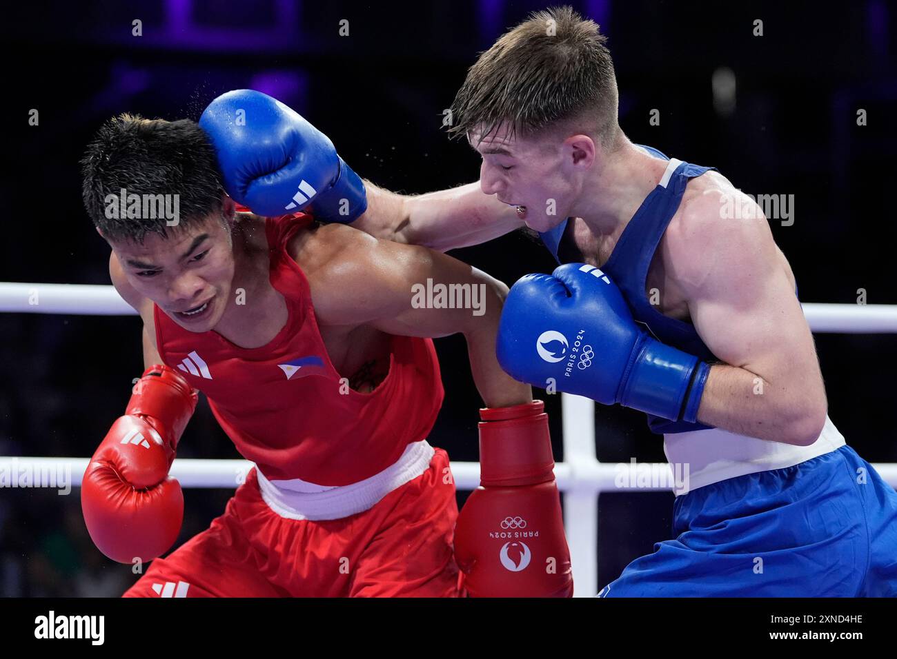 Ireland's Jude Gallagher hits Philippines' Carlo Paalam in their men's ...