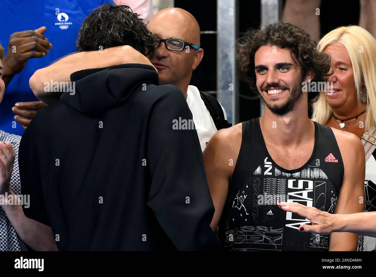 Thomas Ceccon of Italy with his father and his brother during the medal ...