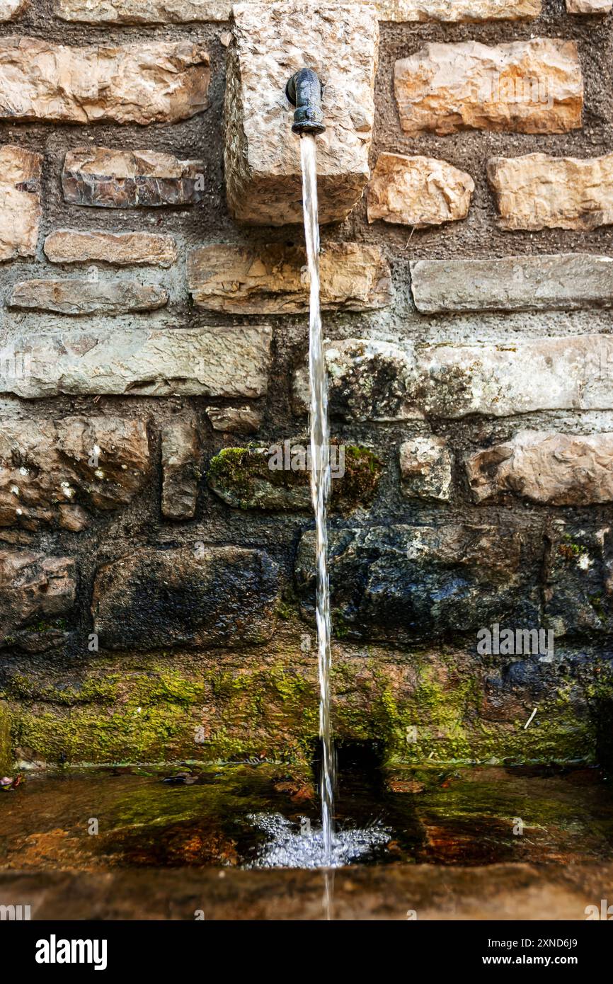 a fountain gushes out fresh mountain water Stock Photo - Alamy