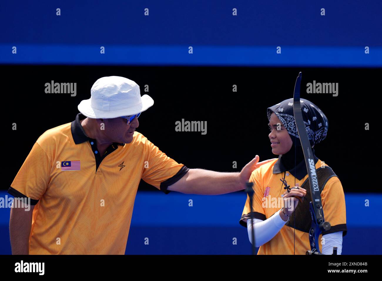 Malaysia Ariana Nur Dania Mohamad Zairi laughs with her coach during ...