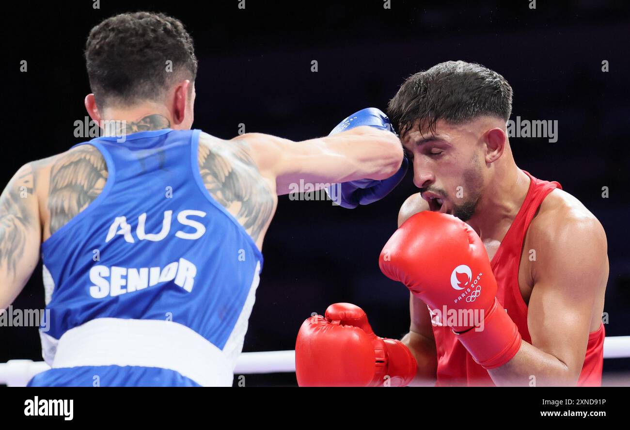Belgian boxer Vasile Usturoi fights during a boxing bout between ...