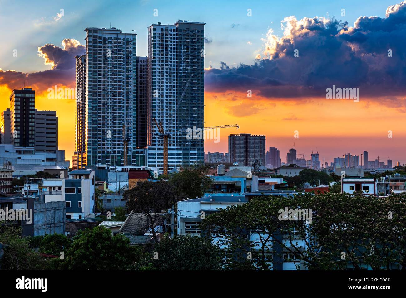 Manila landscape skyline and buildings at sunset, Philippines Stock Photo - Alamy
