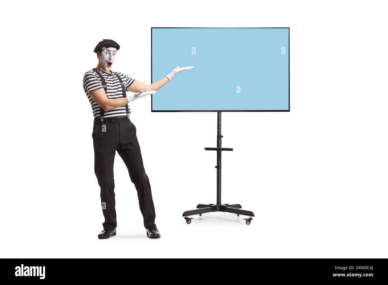 Full length portrait of a mime presenting a tv screen isolated on white ...