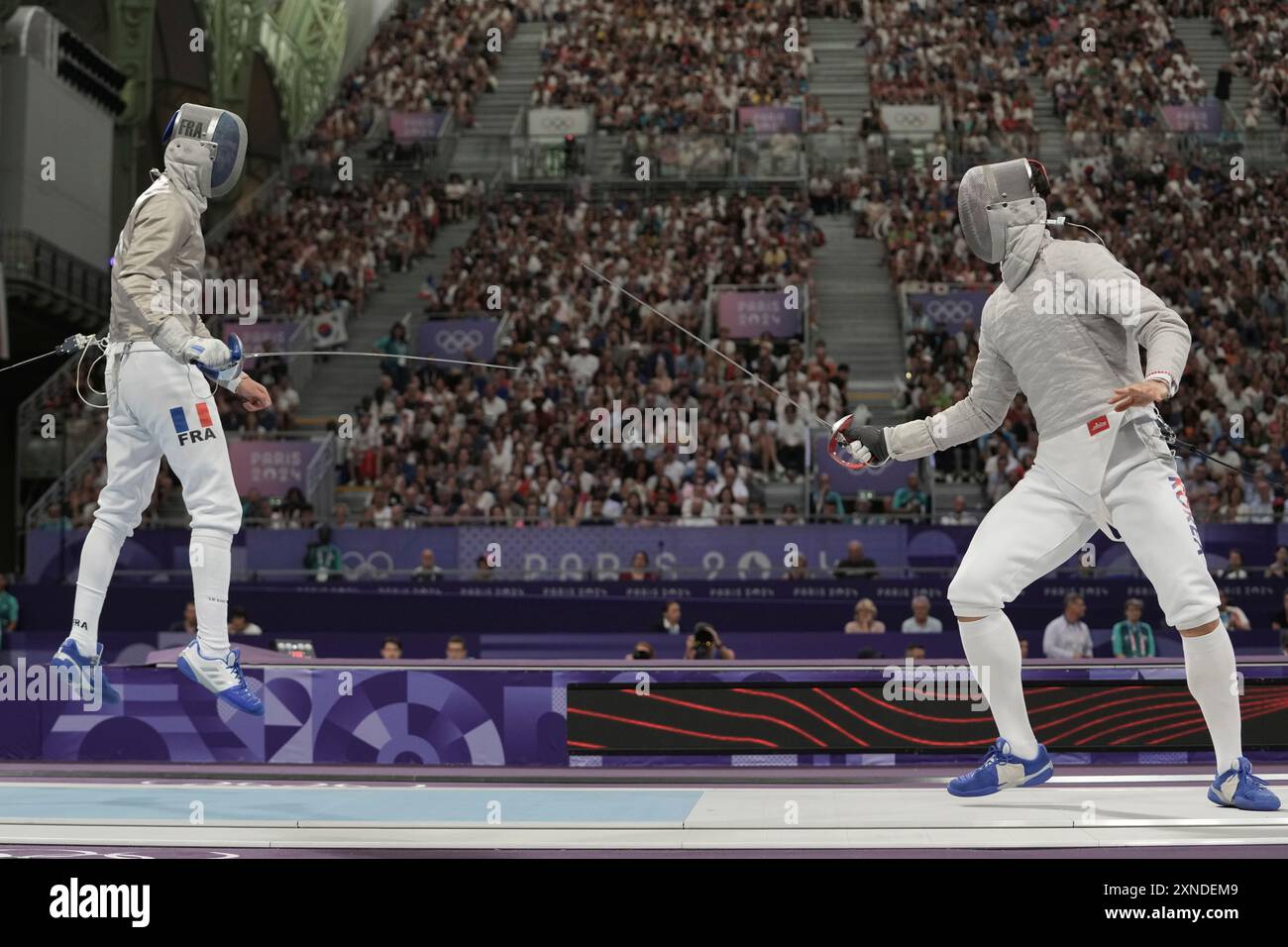 France's Sebastien Patrice, left, competes with South Korea's Oh Sanguk ...